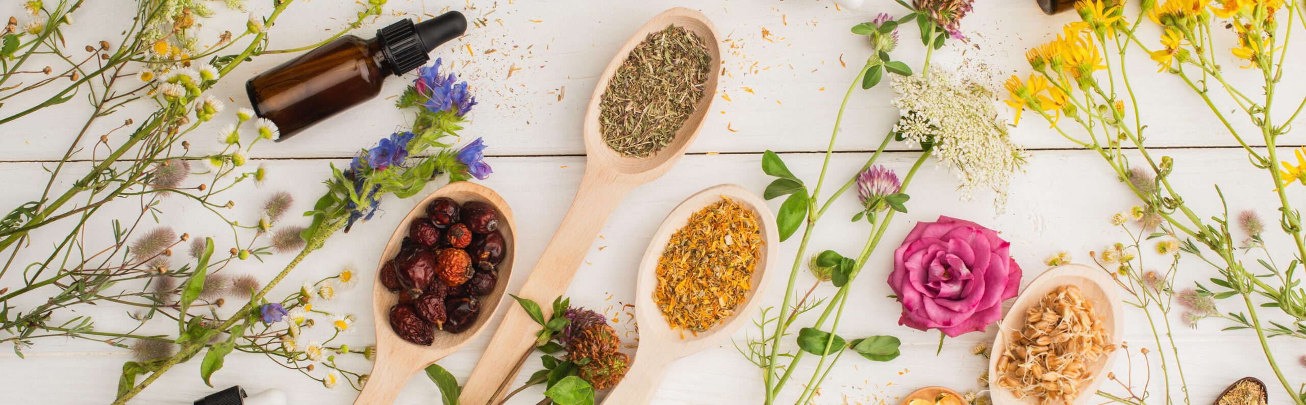 Panoramic,Shot,Of,Herbs,In,Spoons,Near,Flowers,And,Bottle - Integrative ...